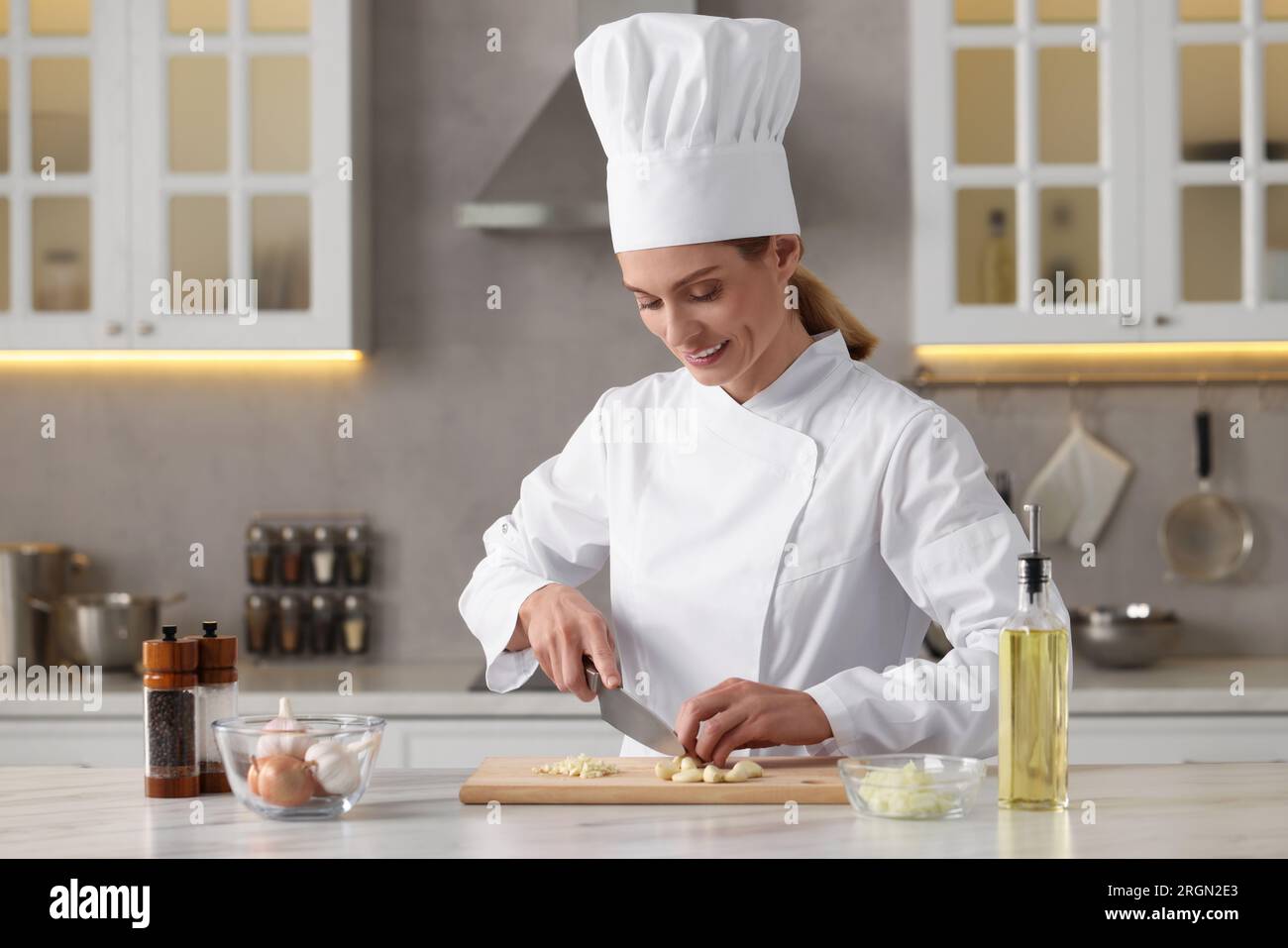 Female chef preparing garlic recipe hi-res stock photography and images ...