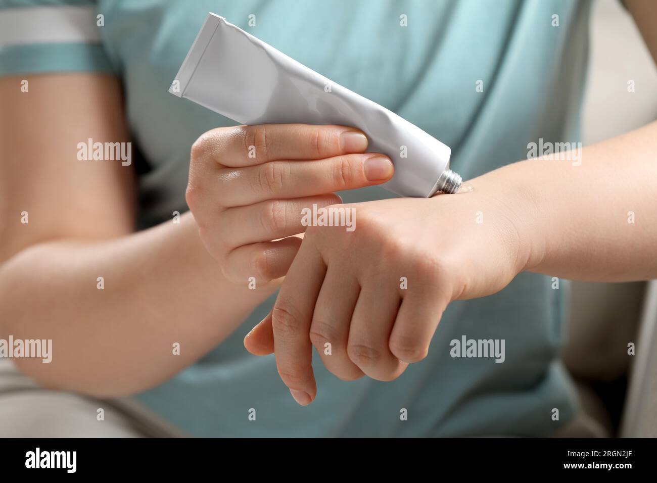 Woman applying ointment from tube onto her wrist, closeup Stock Photo ...
