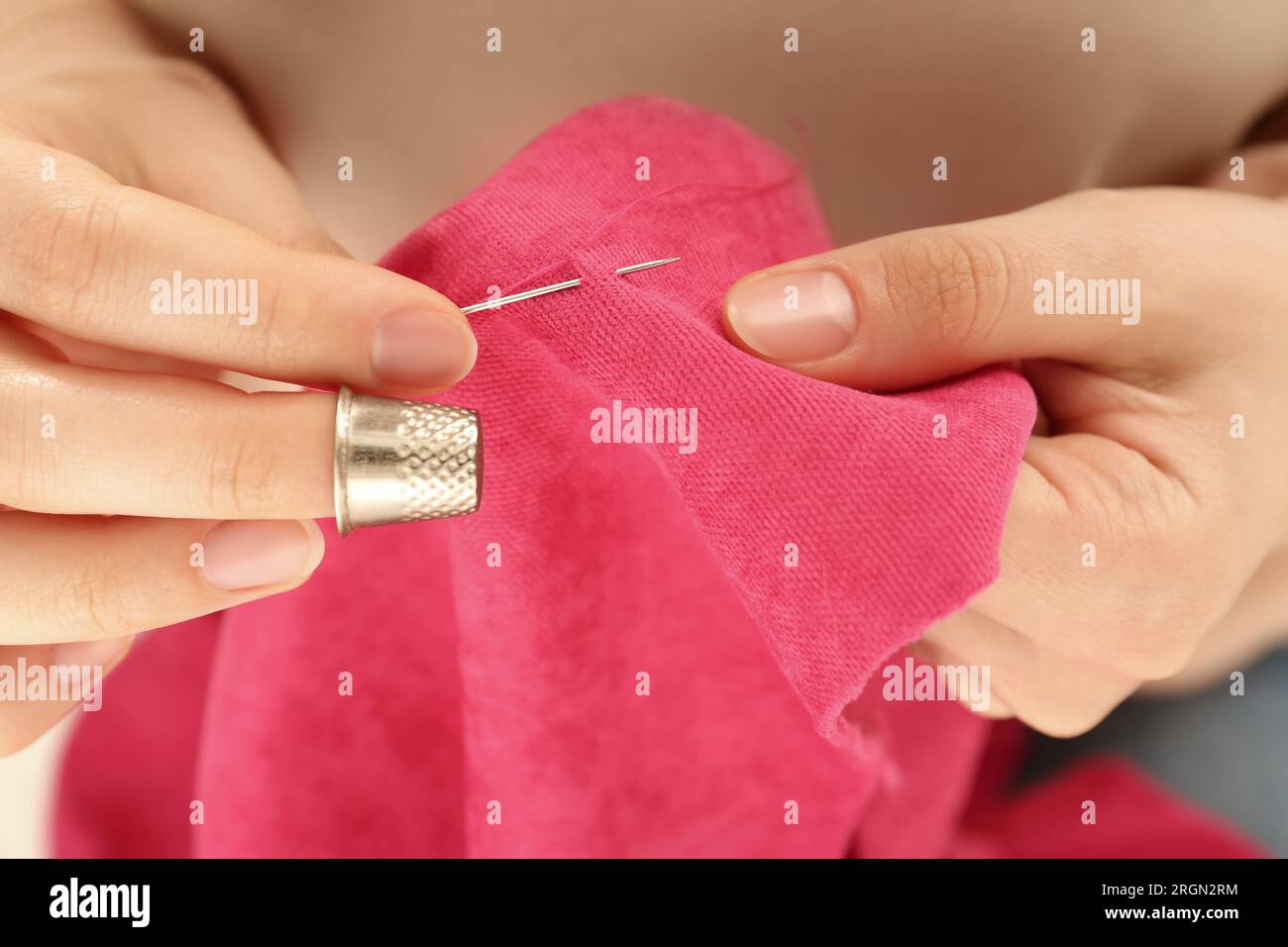 Hands woman seamstress sewing red hi-res stock photography and images ...