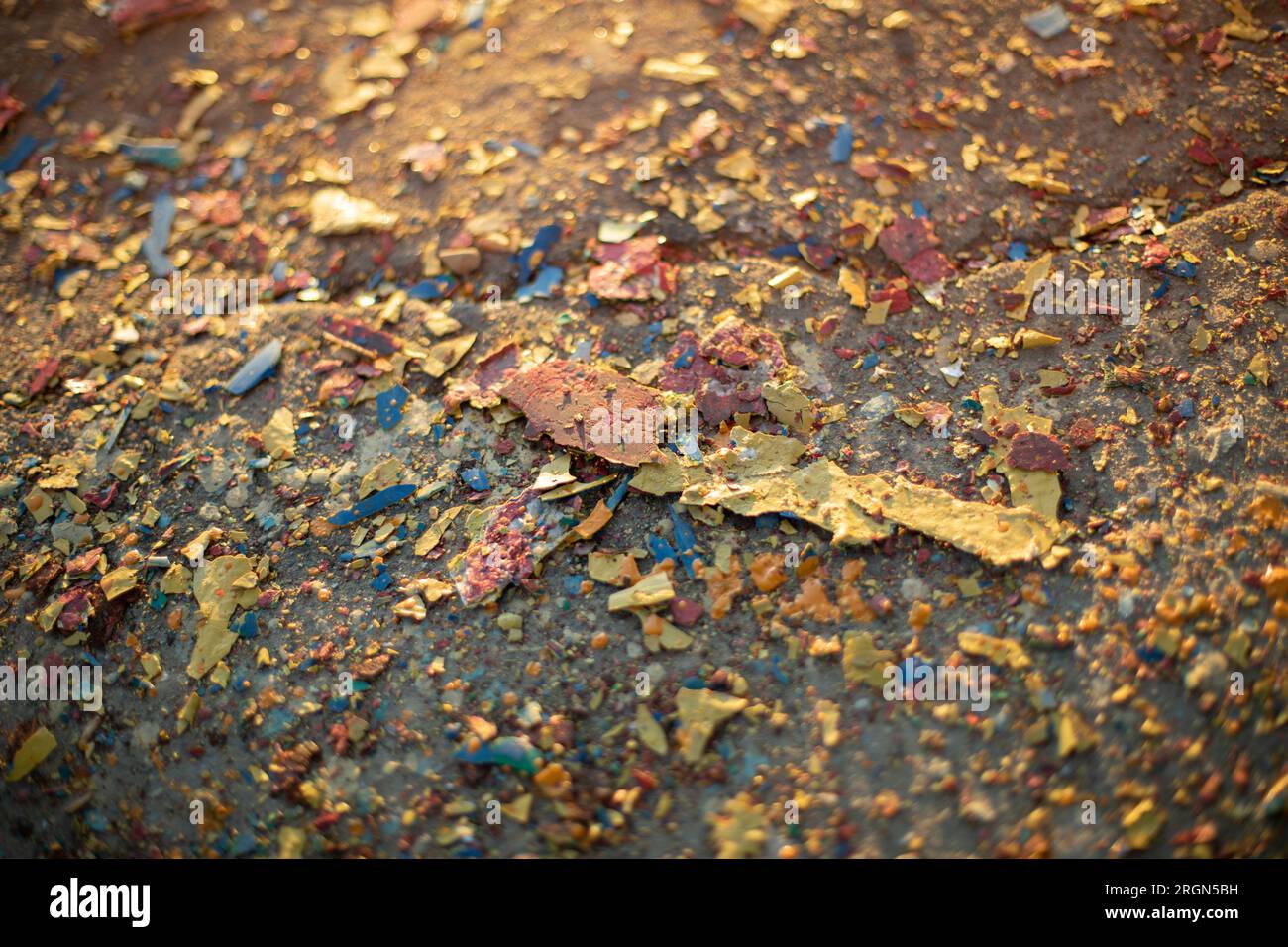 Paint on asphalt. Dirty texture in warm light. Lot of small particles ...