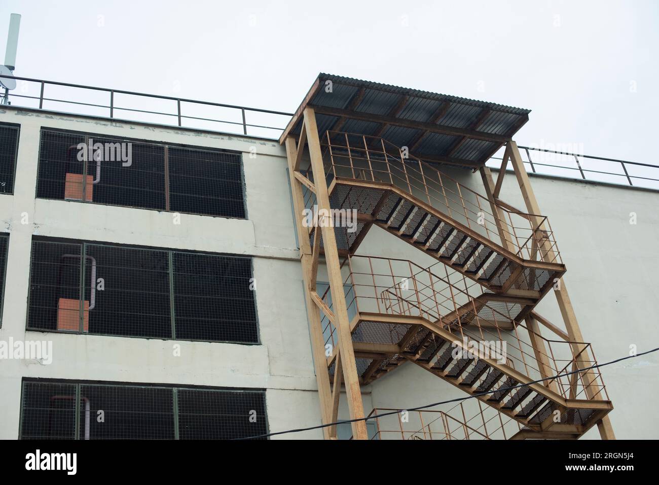 Stairs outside building. Fire escape on wall. Building from courtyard ...