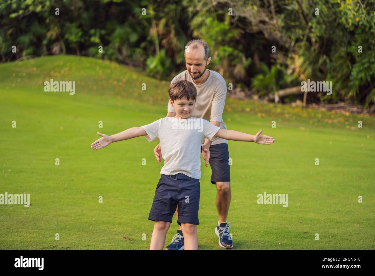 A touching trust exercise as a son falls back into his father's arms ...