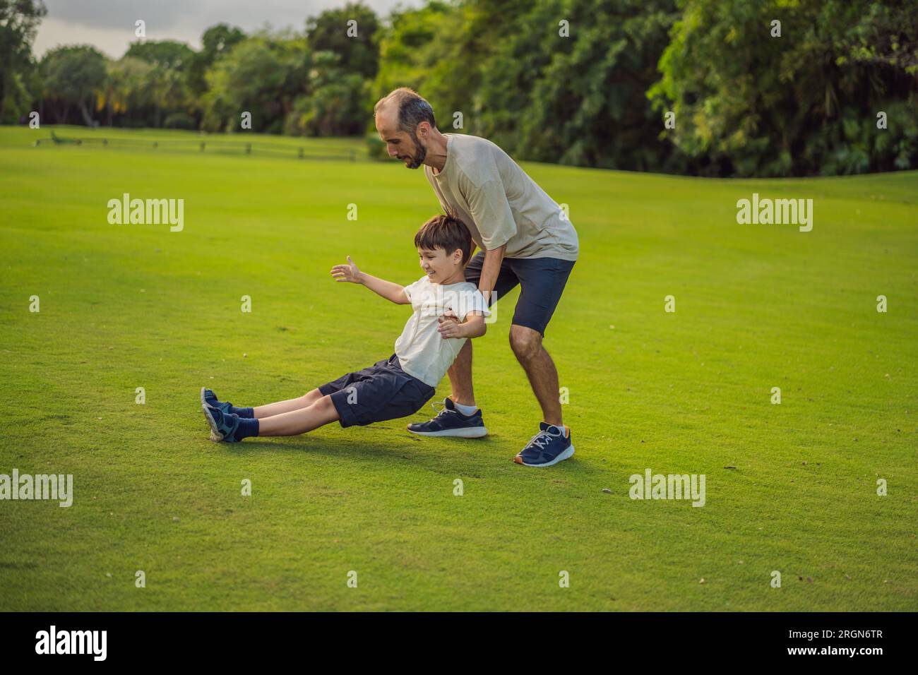 A touching trust exercise as a son falls back into his father's arms ...
