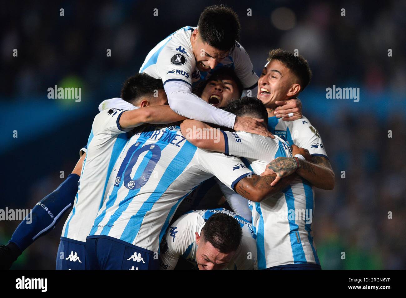 Argentina's Racing Club players celebrate their side's third goal after ...
