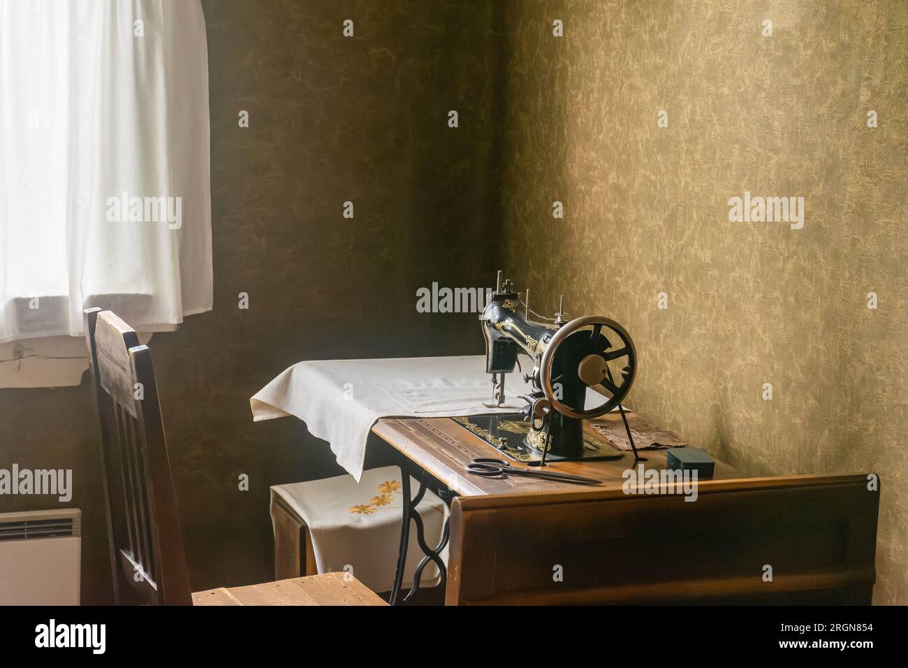 Old machanical sewing machine on table in Amuri museum of historic ...