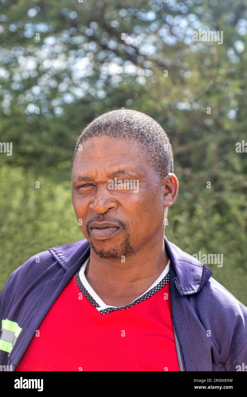 adult african man portrait, head and shoulders , standing in the street ...