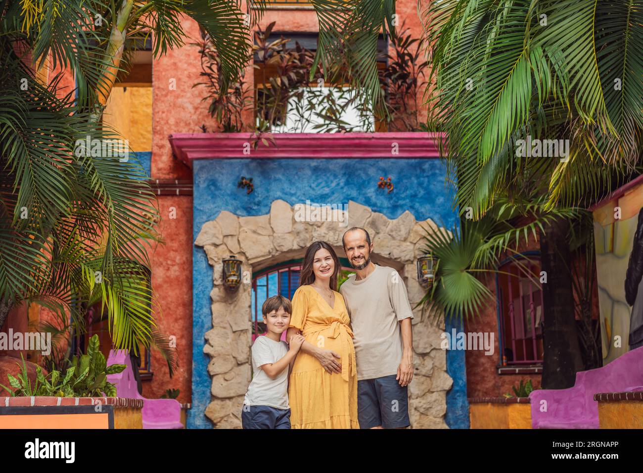 A loving couple in their 40s and their teenage son cherishing the ...