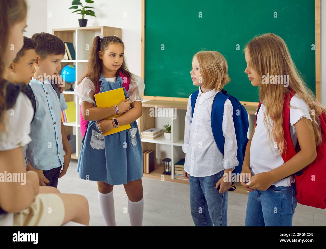 Shy child in class hi-res stock photography and images - Alamy