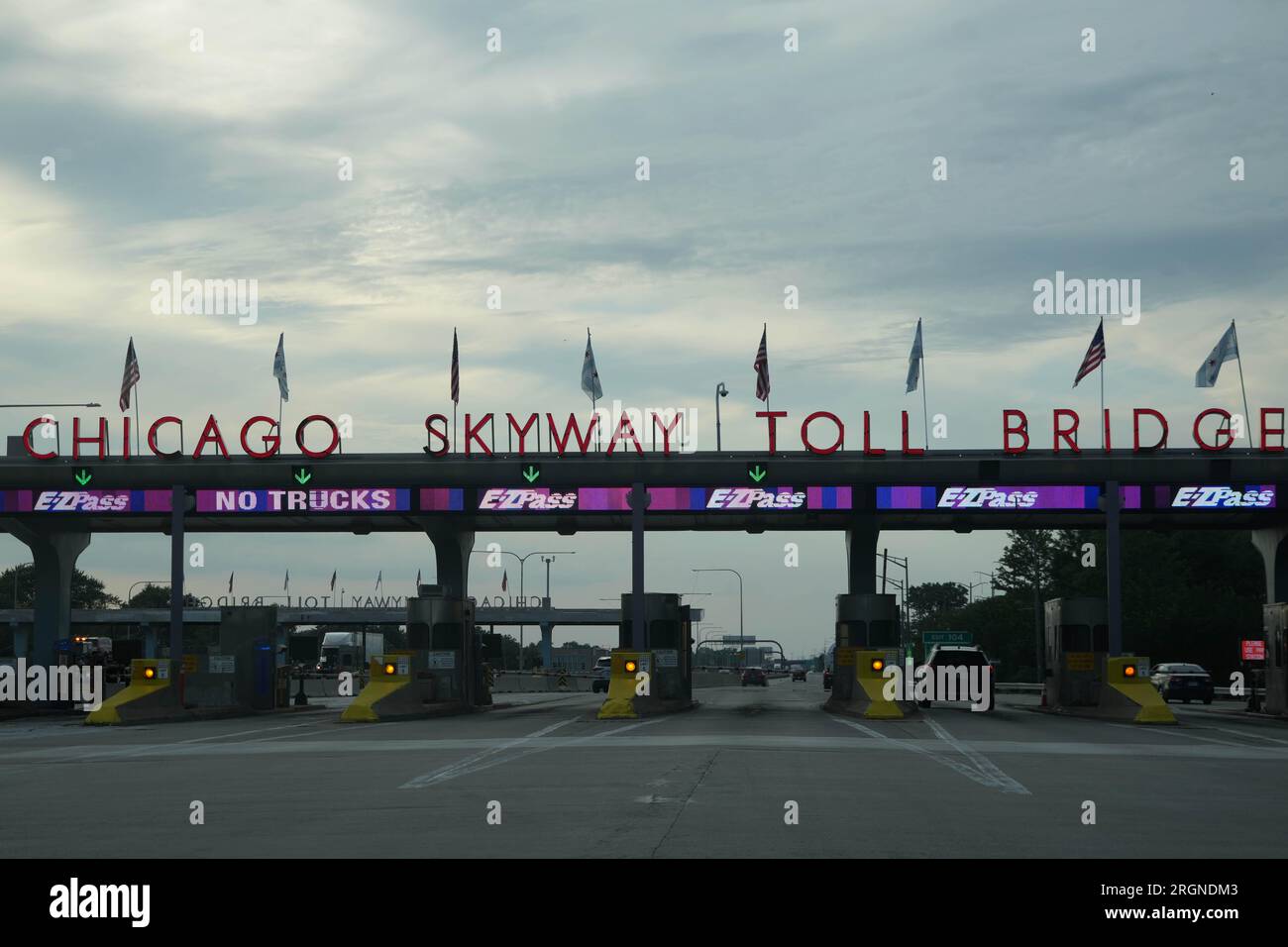 Motorists pass through the Chicago Skyway Toll Bridge plaza on the ...