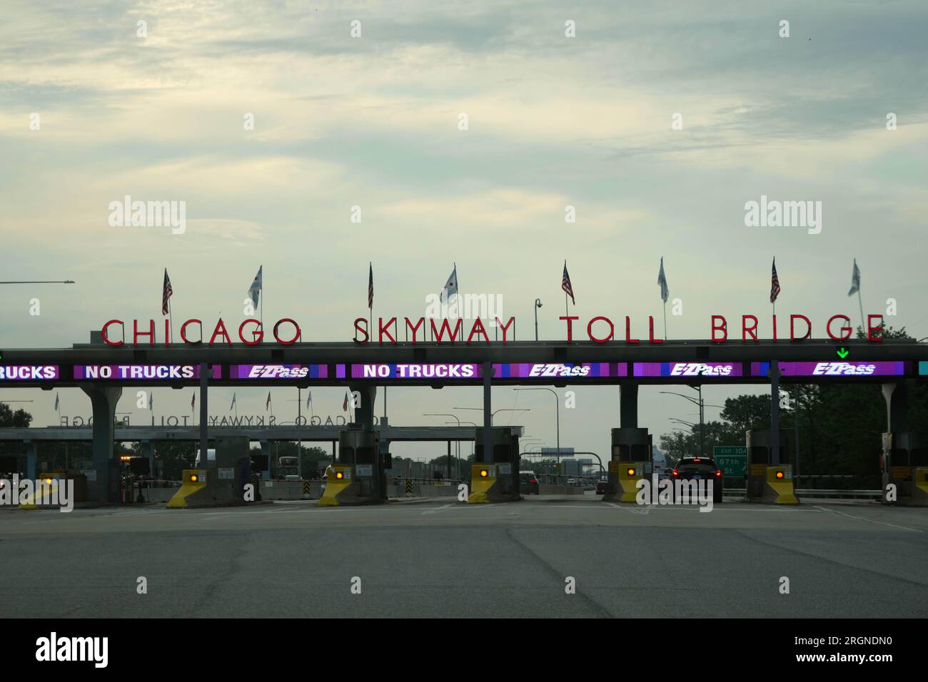 Motorists pass through the Chicago Skyway Toll Bridge plaza on the ...