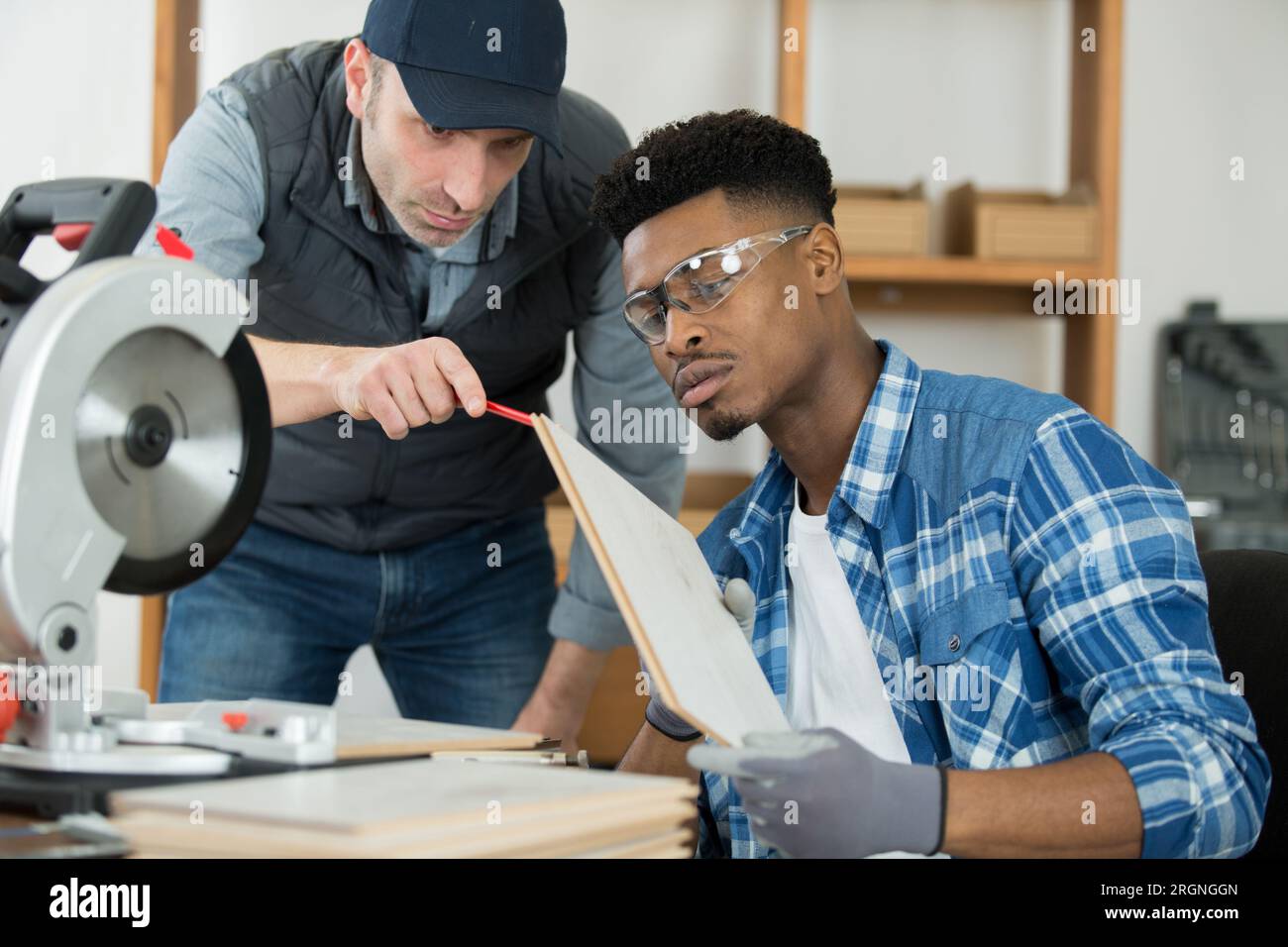 men using portable tool circular saw Stock Photo - Alamy