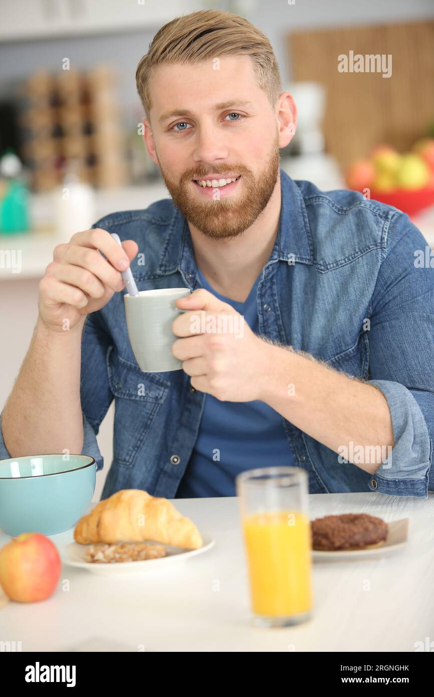 healthy adult man having breakfast in apartment Stock Photo - Alamy