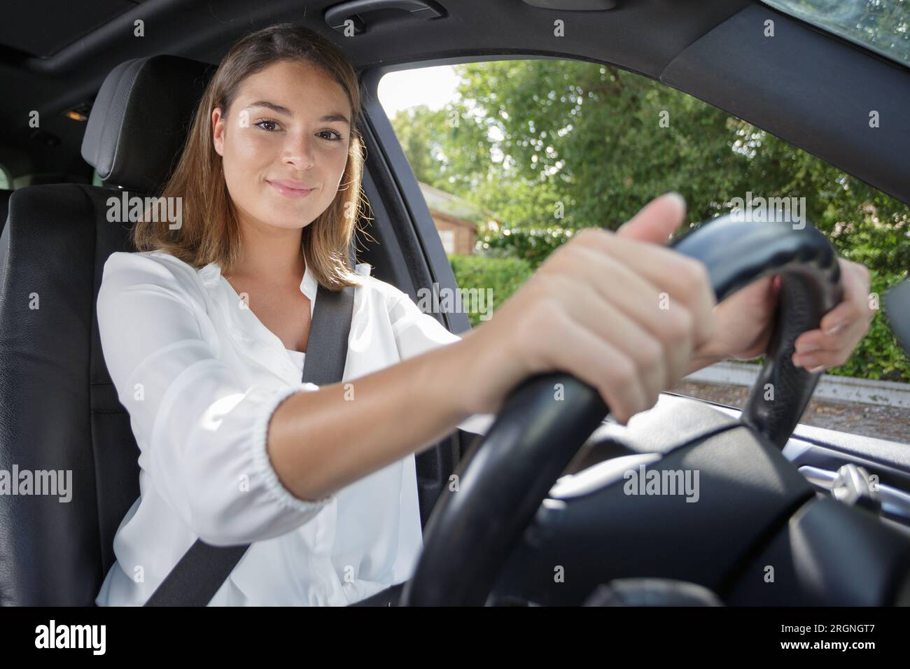 young woman driving her car Stock Photo - Alamy