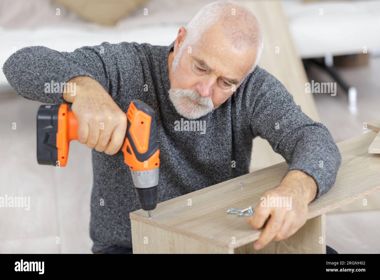 Handy man drilling hi-res stock photography and images - Alamy