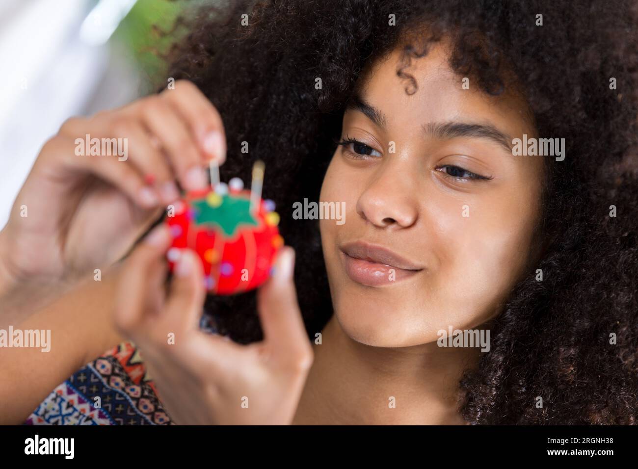 Woman holding safety pin hi-res stock photography and images - Alamy