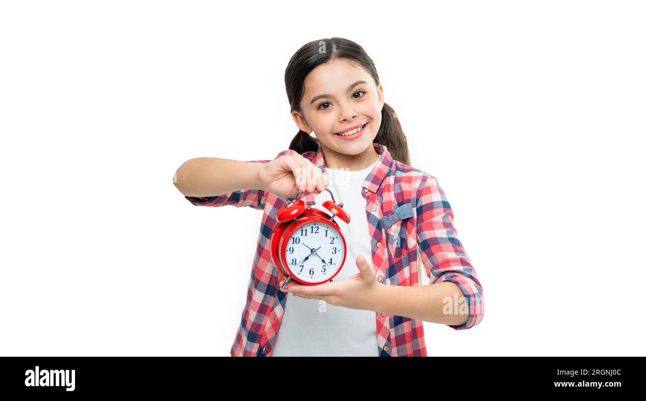teen girl holding alarm time on background. photo of teen girl with ...