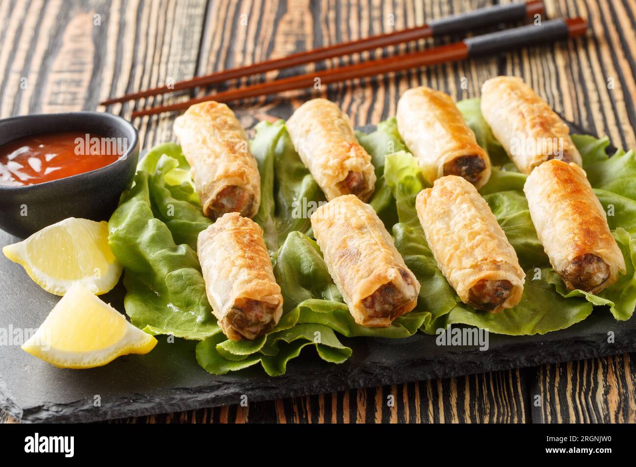 Vietnamese nems or deep fried spring rolls with chicken closeup on the ...