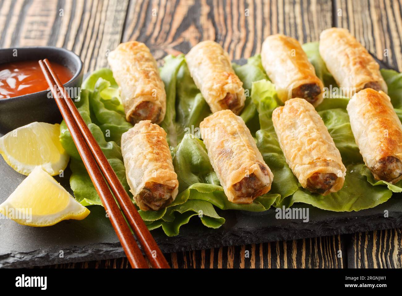 Vietnamese nem fried spring rolls with chicken and vegetables served ...