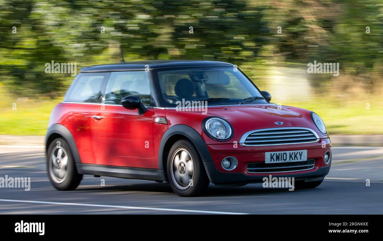 Milton Ketnes,UK - Aug 10th 2023: 2010 red Mini car driving on an ...