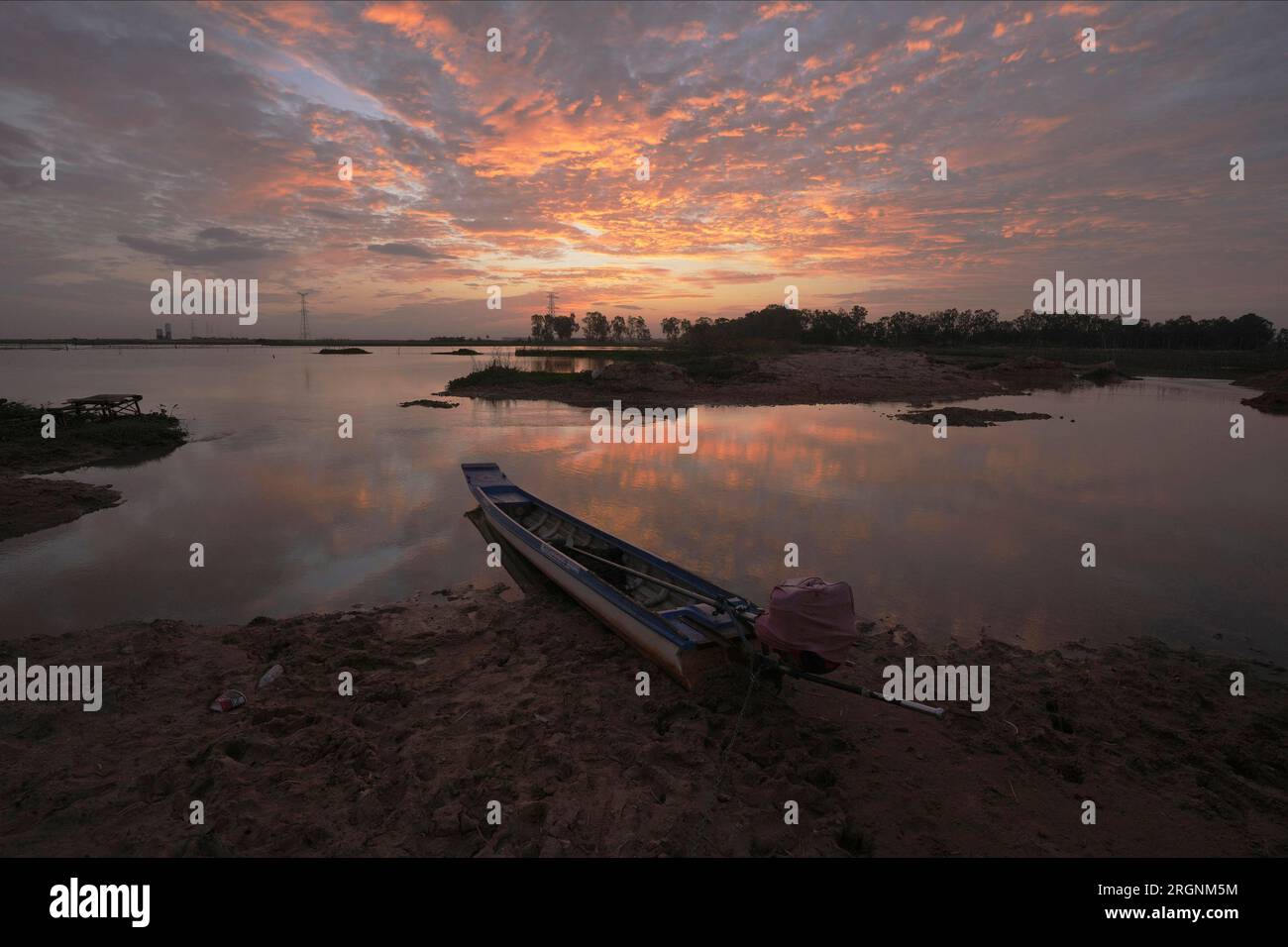 A fishing boat is anchored at Boeung Tamok lake on the outskirts of ...