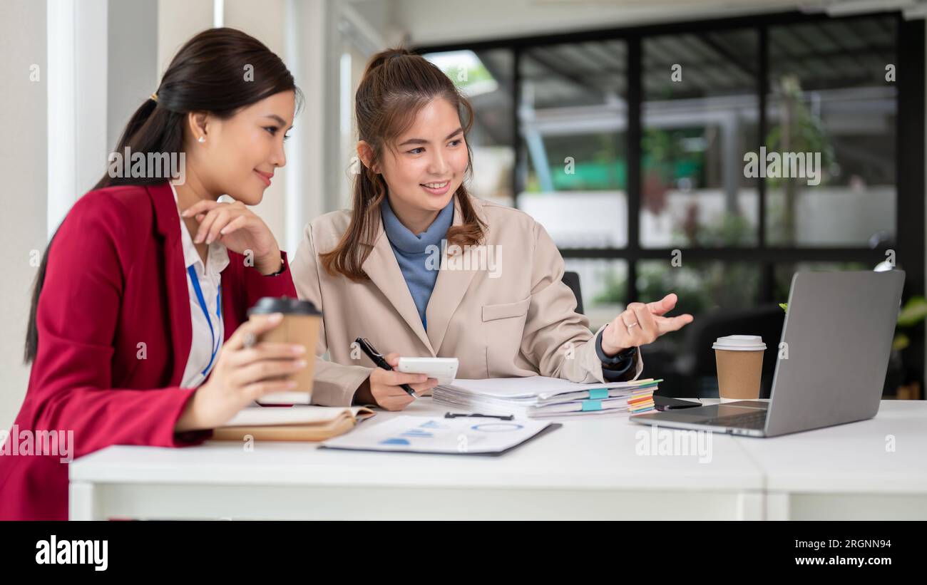 A professional Asian female financial analyst is presenting her project ...