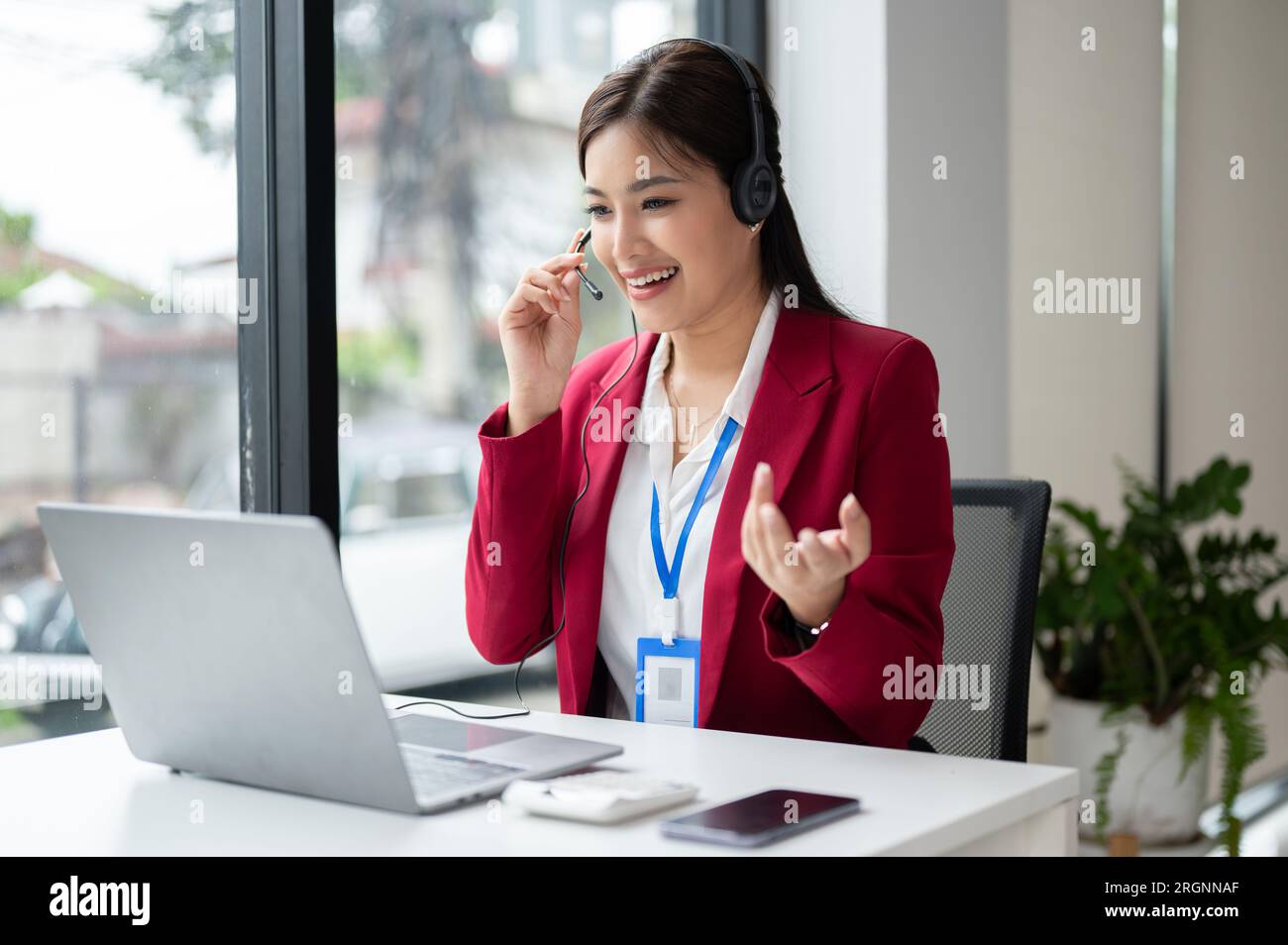 Asian female agent talking hi-res stock photography and images - Alamy
