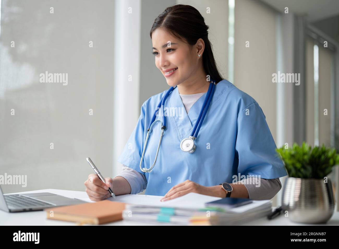 Female doctor counseling a woman with a health report. hi-res stock photography and images - Alamy