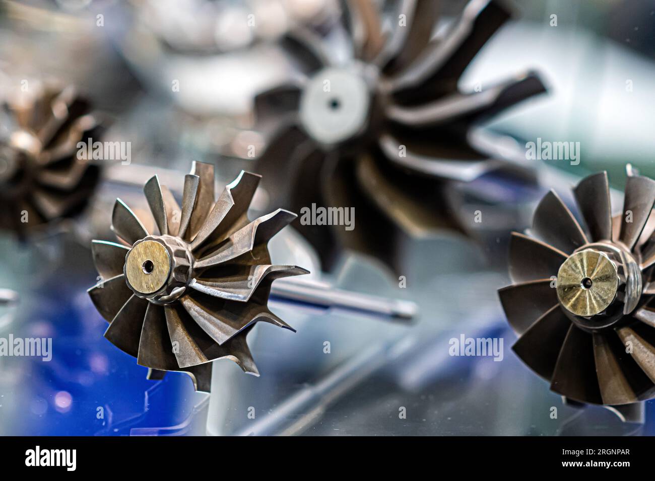 abstract background with car engine parts in a glass showcase, close-up ...