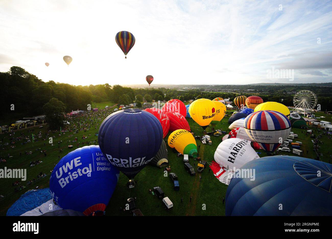 Hot air balloons are inflated during the mass ascent at the Bristol ...