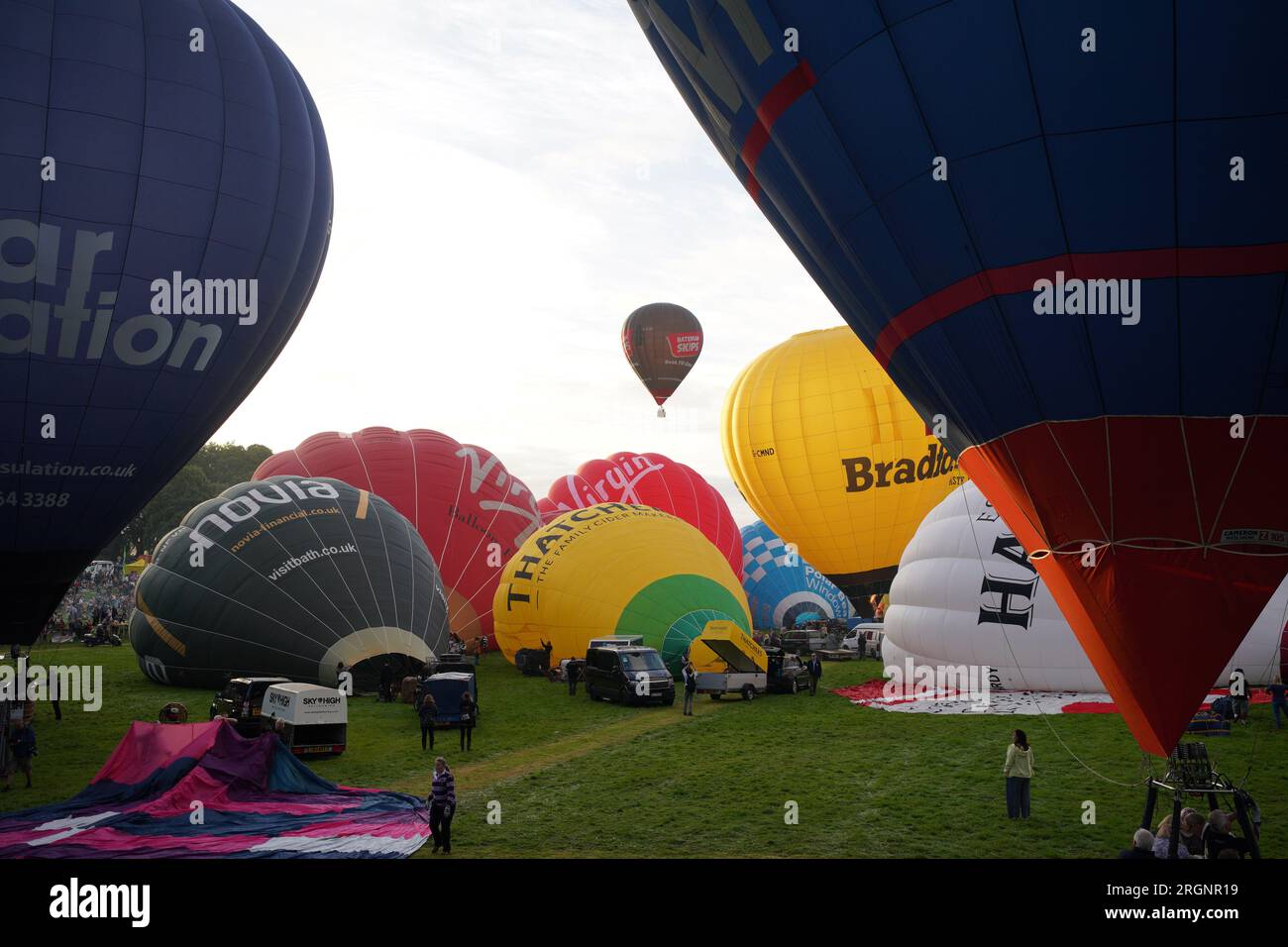 Hot air balloons are inflated during the mass ascent at the Bristol ...