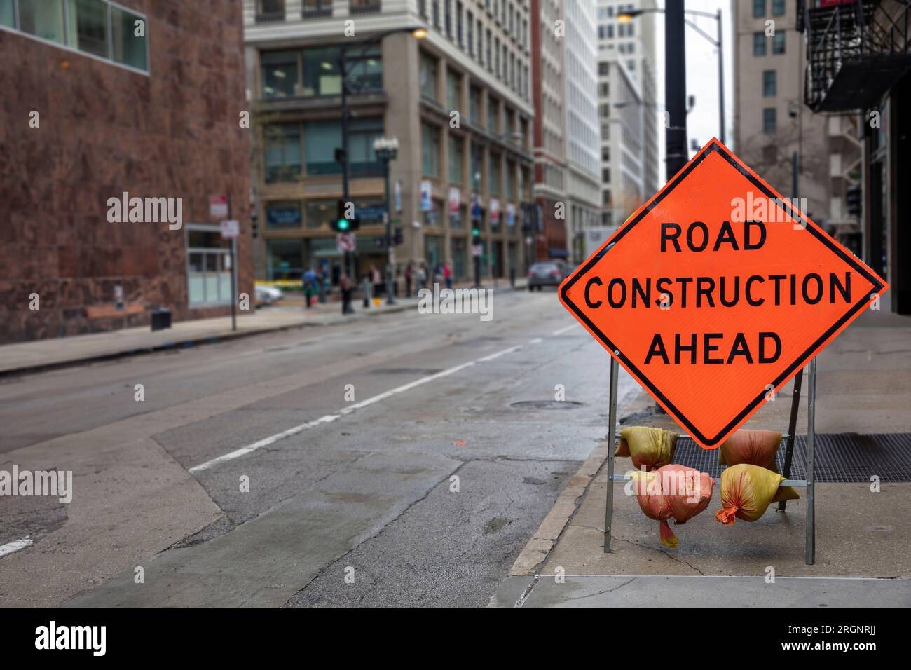 Road construction ahead text, road warning in orange rhombus sign, work ...