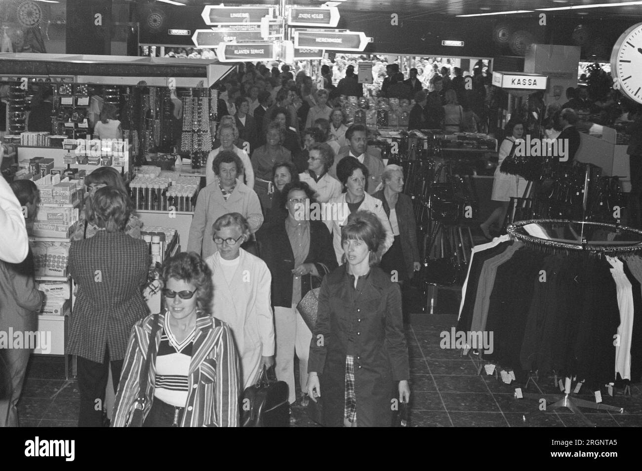 Shoppers browse through a new department store by Vroom and Dreesman ...