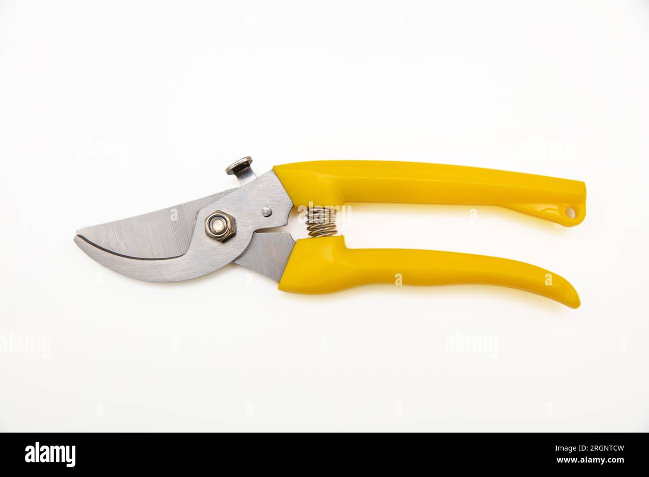 Garden pruning shears closed, yellow color handle isolated on white ...