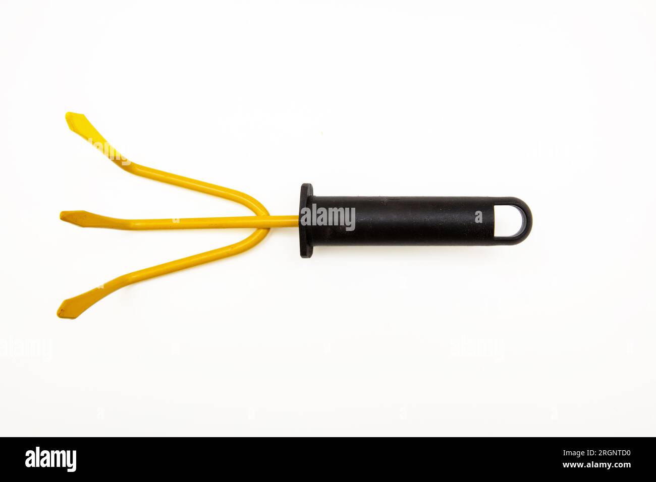 Garden rake yellow color isolated on white background, view from above ...