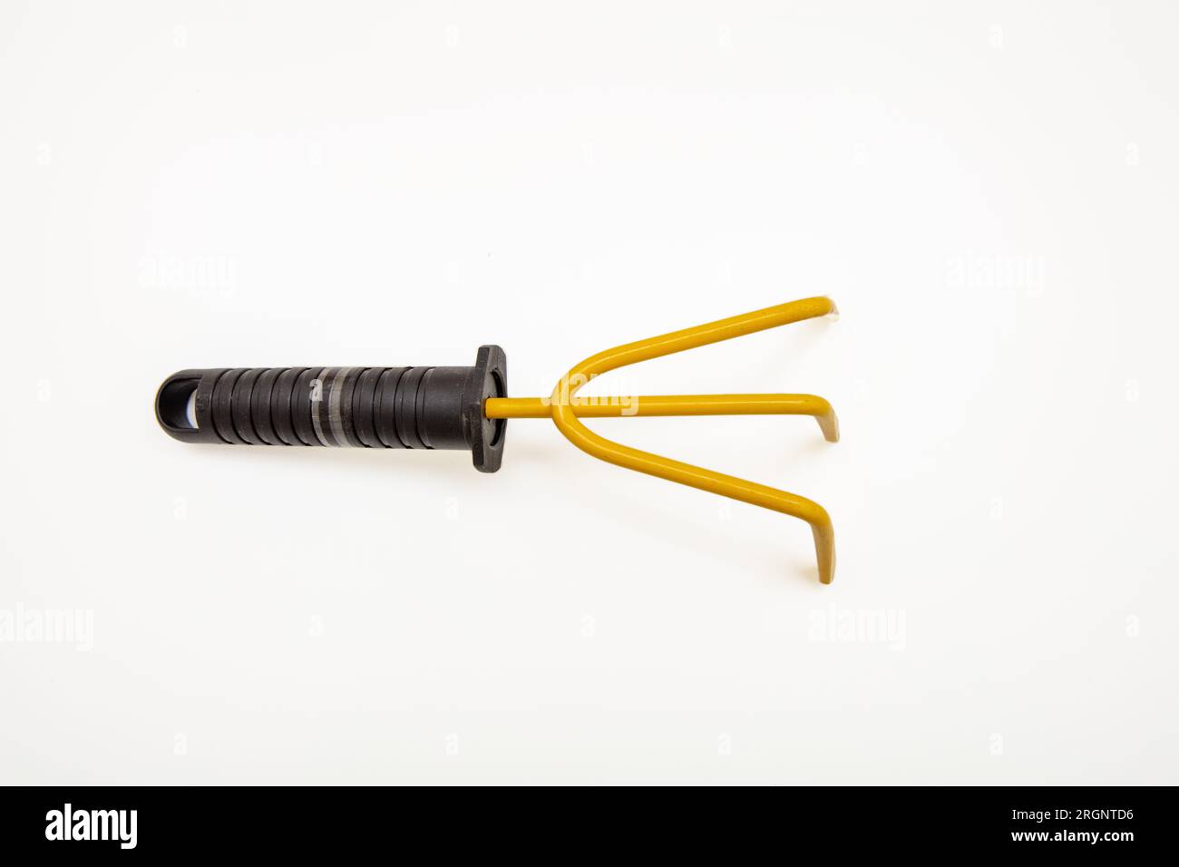 Garden rake yellow color isolated on white background, view from above ...