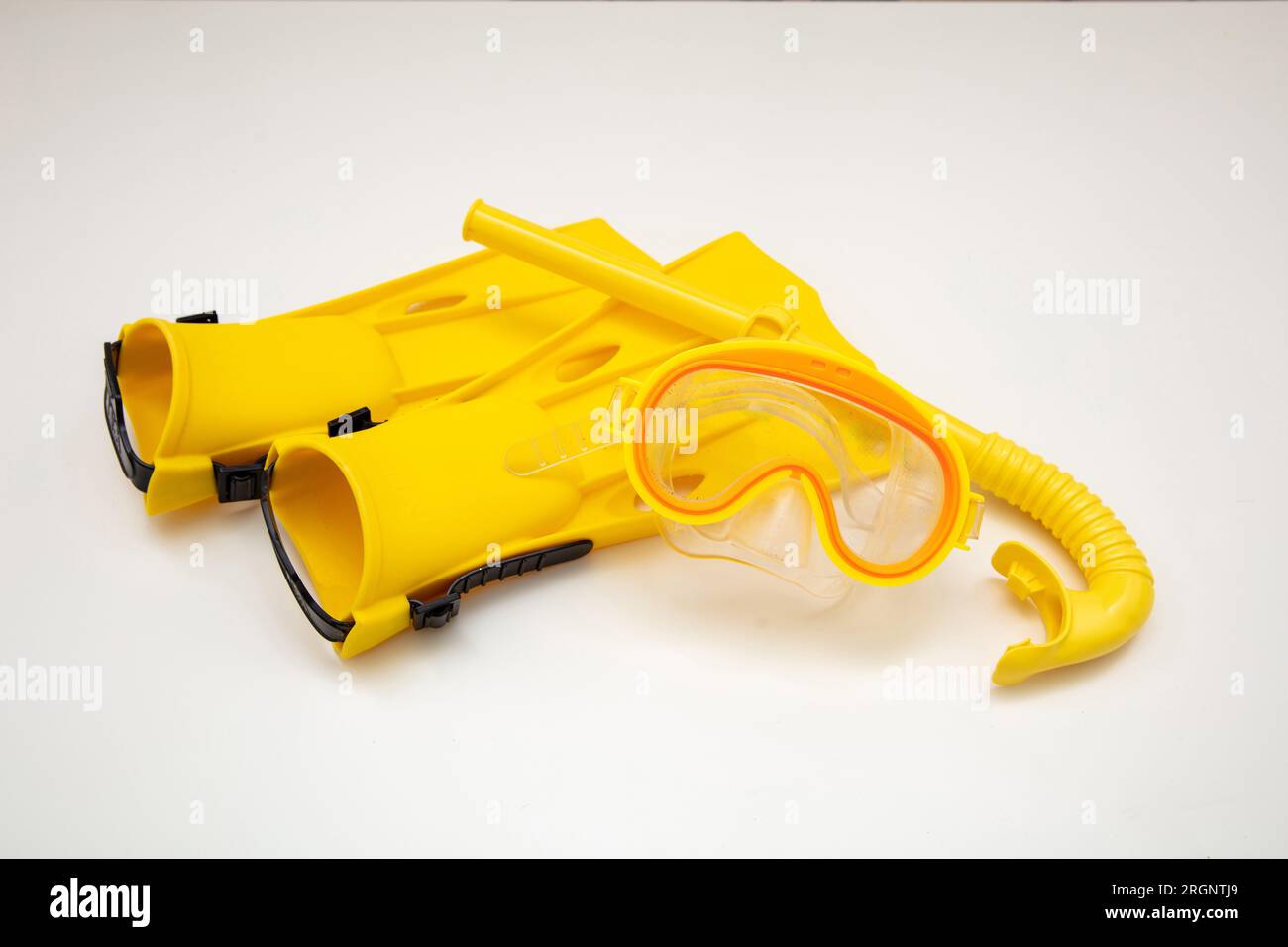 Yellow diving equipment, mask snorkel and flippers isolated on white ...