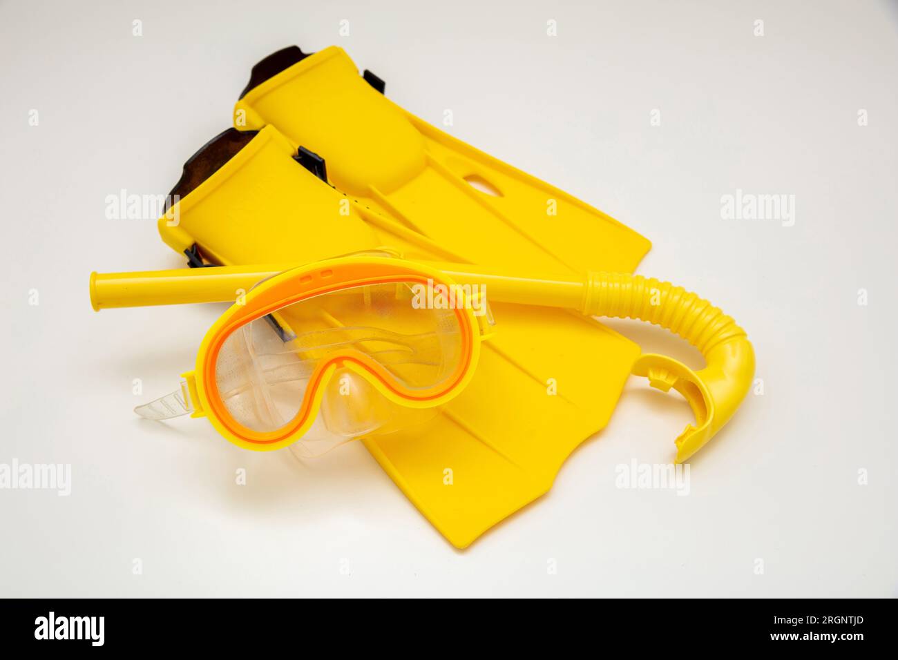 Yellow diving equipment, mask snorkel and flippers isolated on white ...