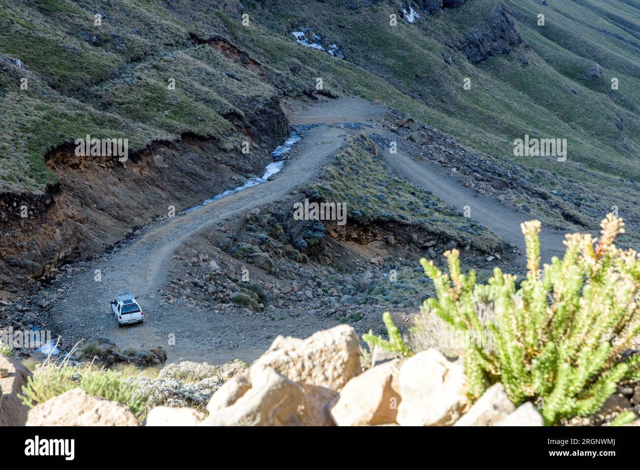 Off-road vehicle travelling down the famous Sani pass between South ...