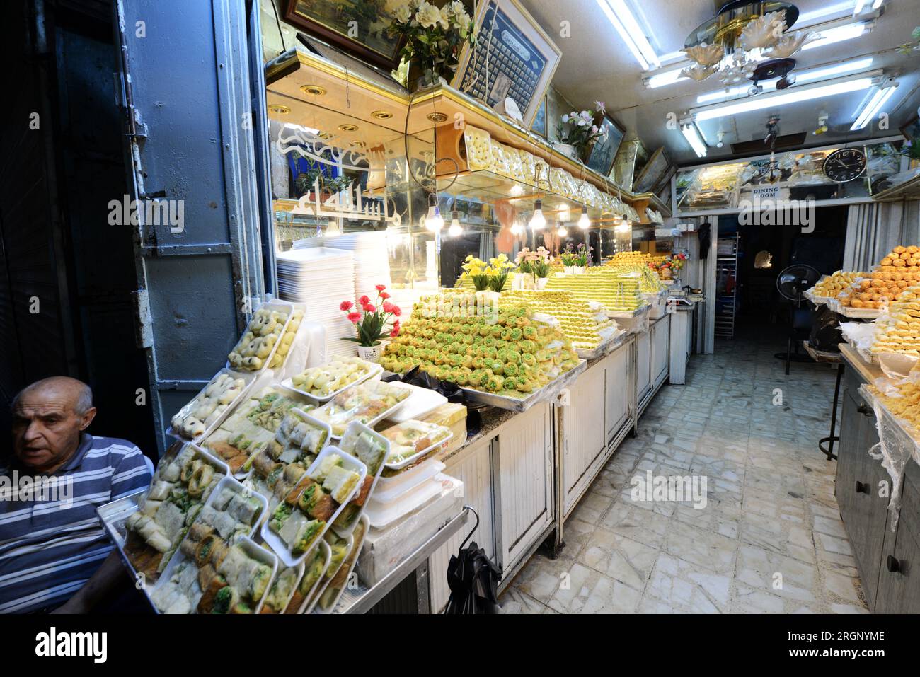 Traditional Arabic Baklava pastries sold at a small pastry shop in the ...