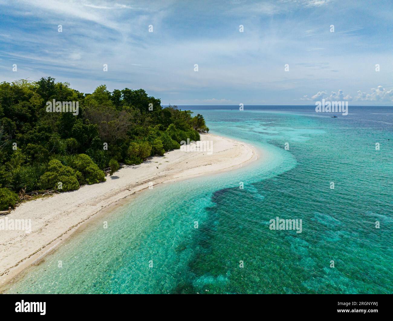 Flying over the white beach of Mantigue Island. Camiguin, Philippines ...