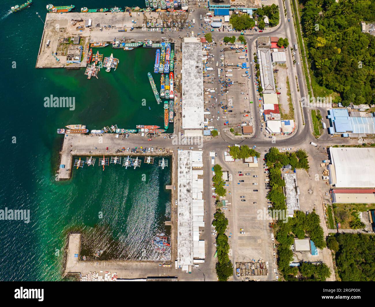 Top aerial view of Fish Port in General Santos. Sunlight reflects down ...