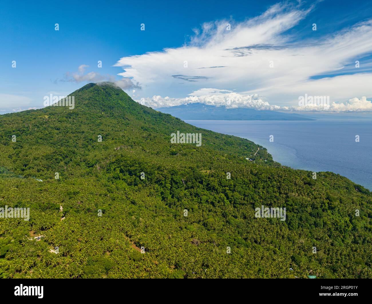 Aerial view of mountain hill with forest and jungle. Blue sky and ...