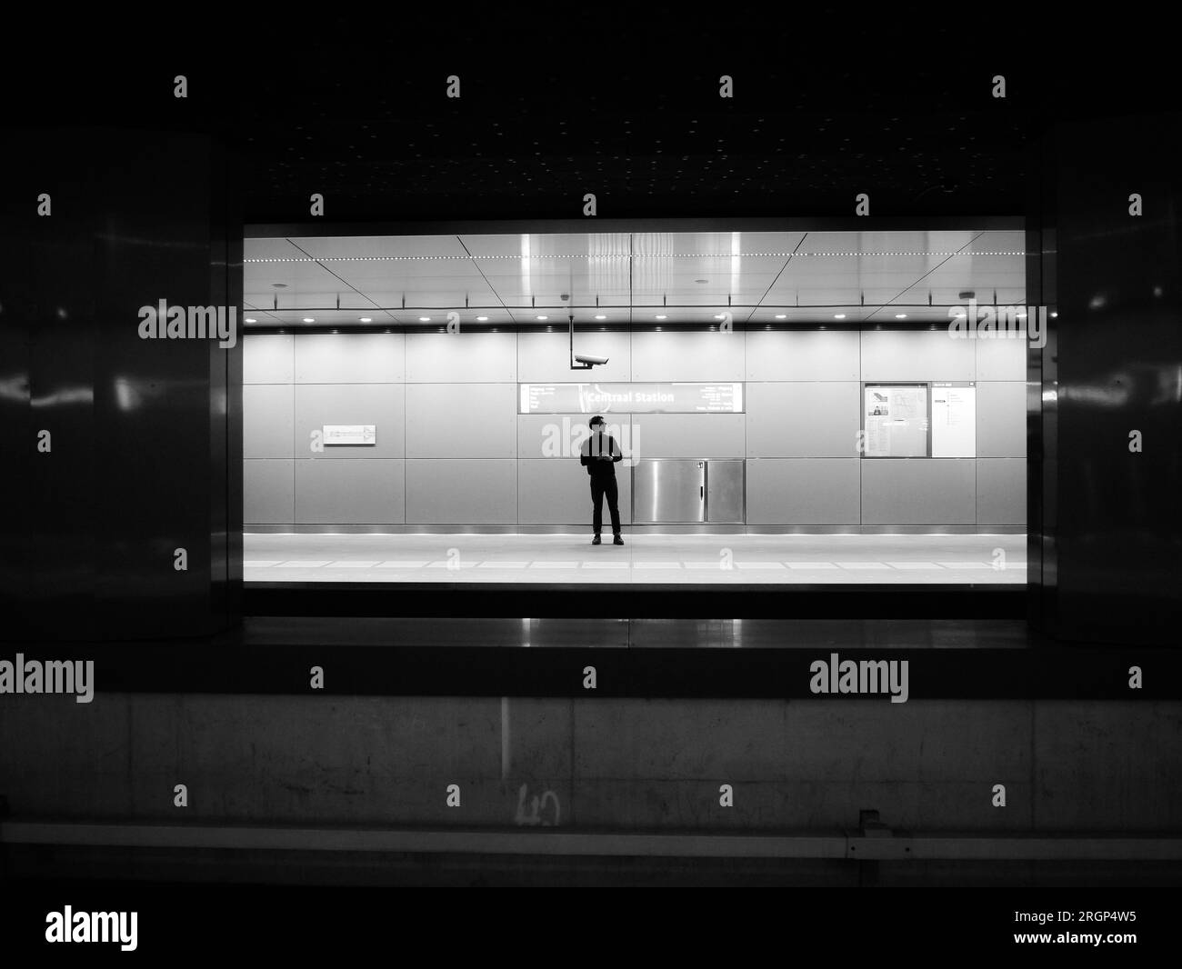 Person waiting train in station hi-res stock photography and images - Alamy