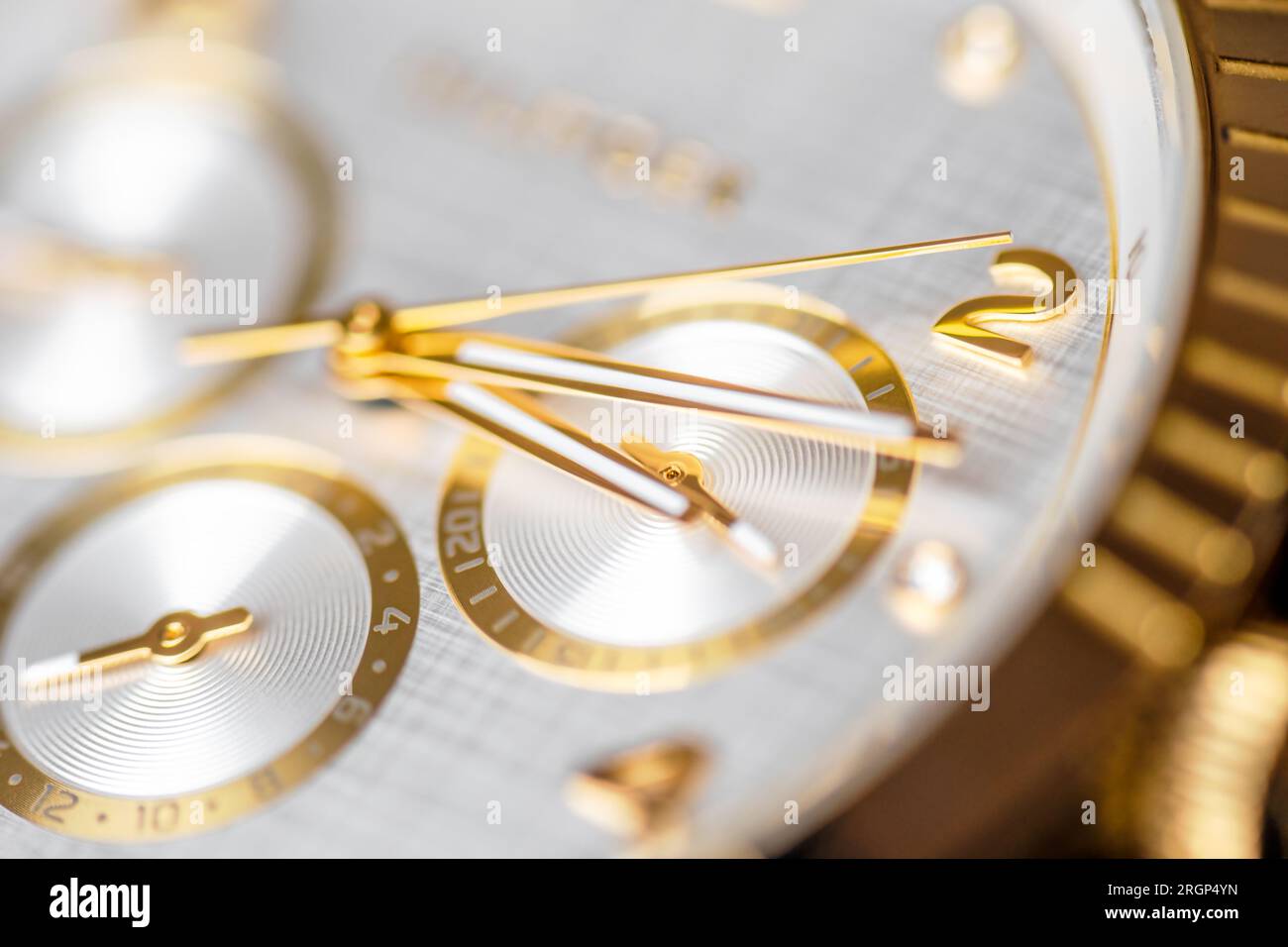 Wrist clock. Close up of a golden clock face with ticking arms Stock ...