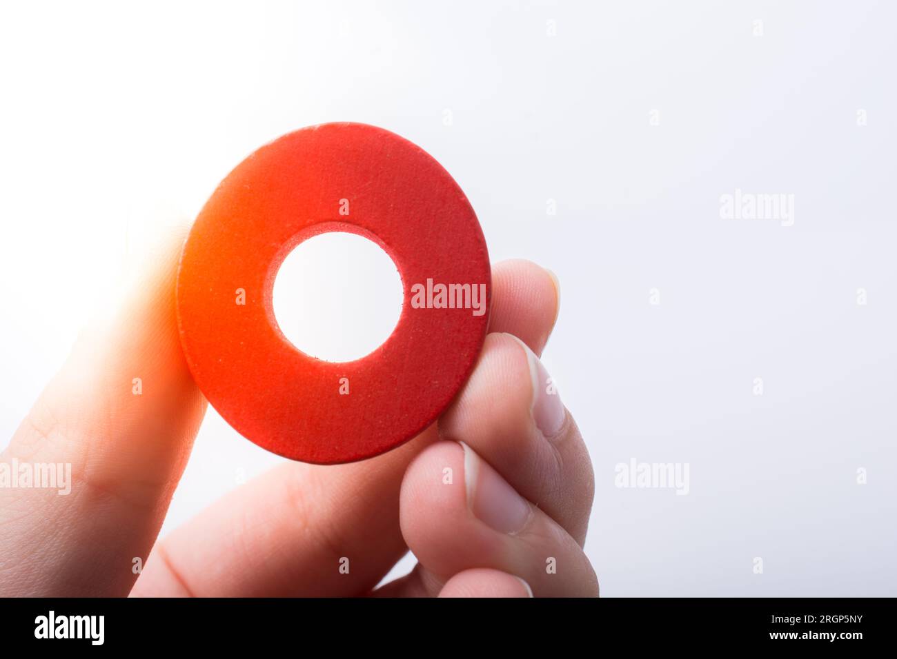 Hand holding Letter cube O of Alphabet Stock Photo - Alamy