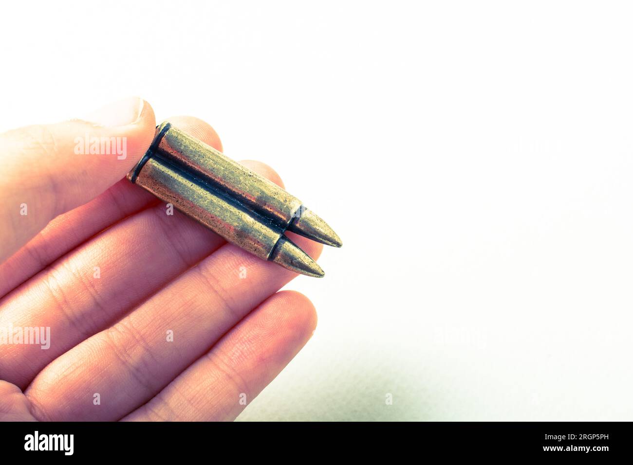 Bullet in hand as Conceptual against the war photography Stock Photo ...