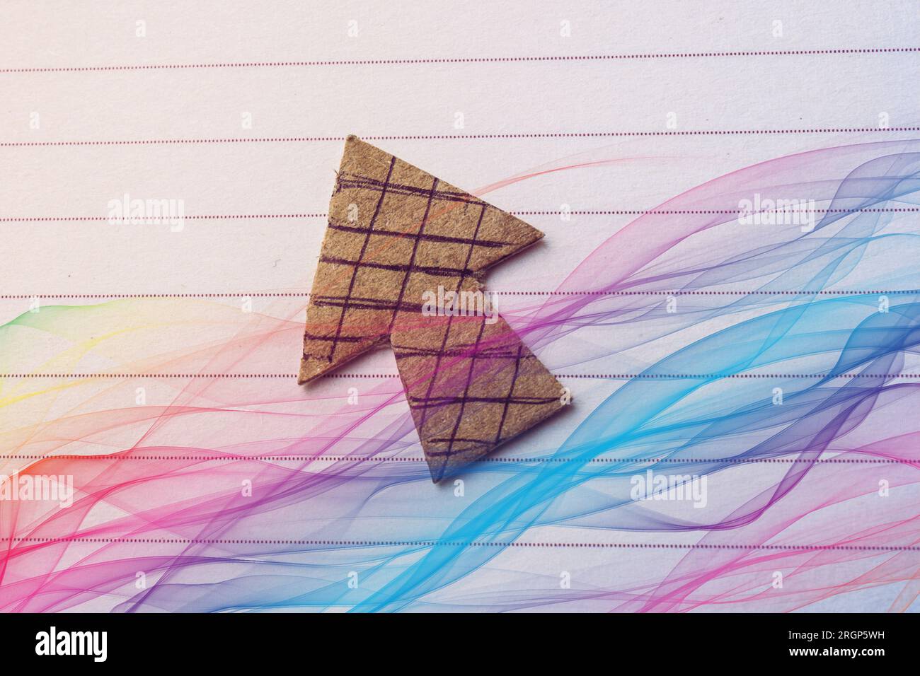 Arrow sign cut out of paper placed on paper Stock Photo - Alamy