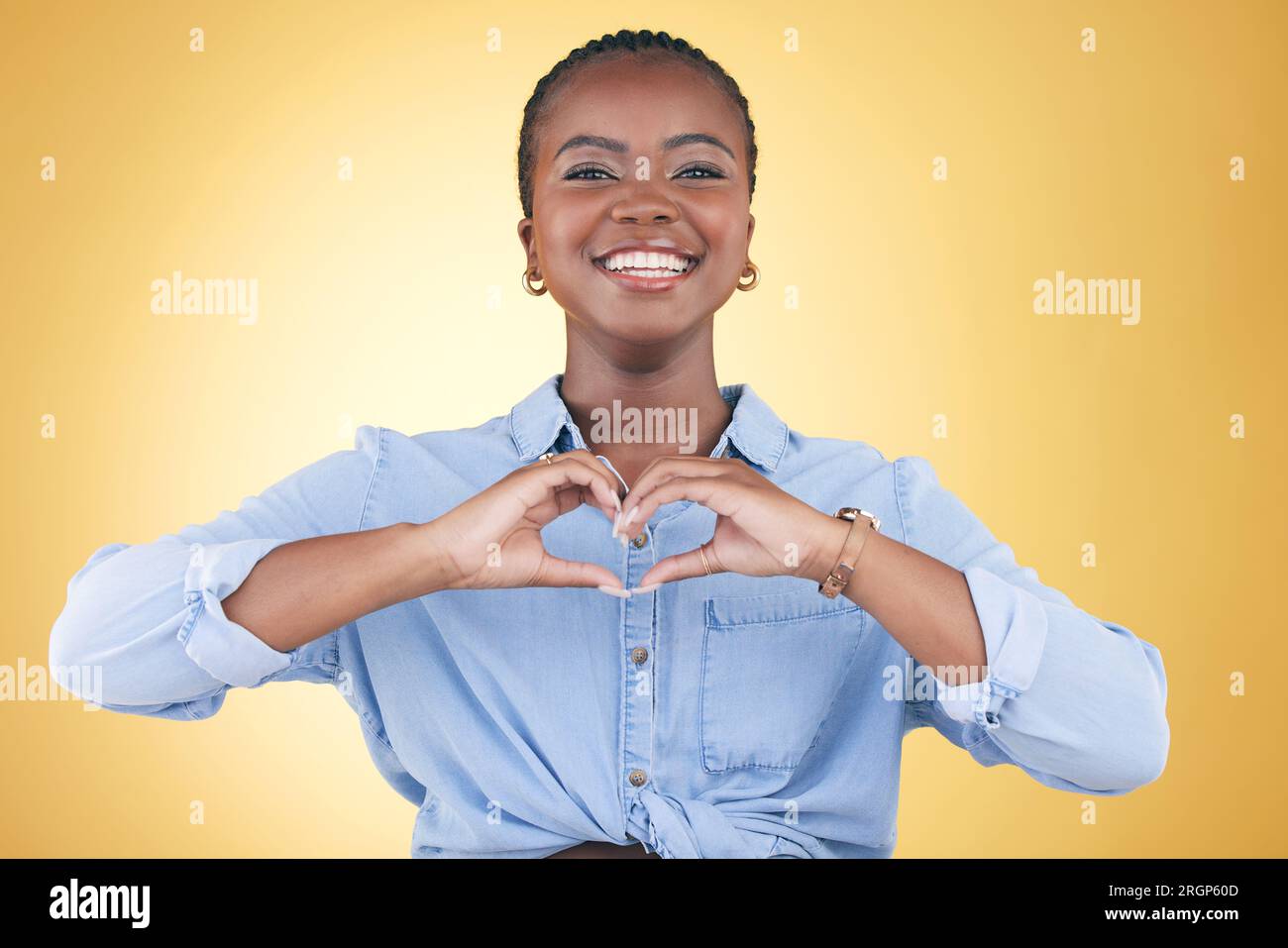 Happy black woman, portrait and heart hands for support, love or care ...
