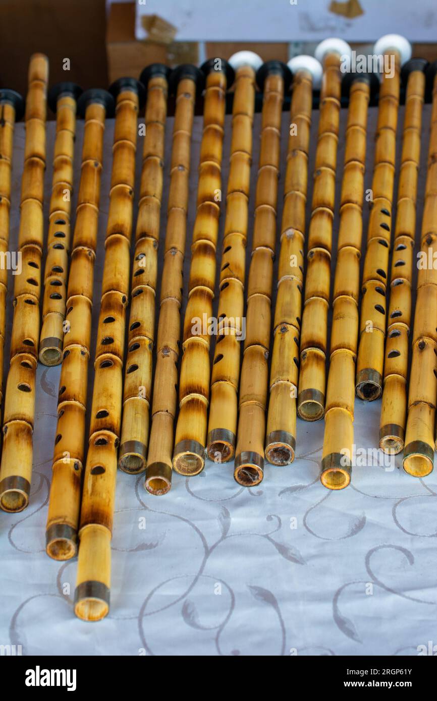 Dozens of handmade bamboo flutes in display Stock Photo - Alamy