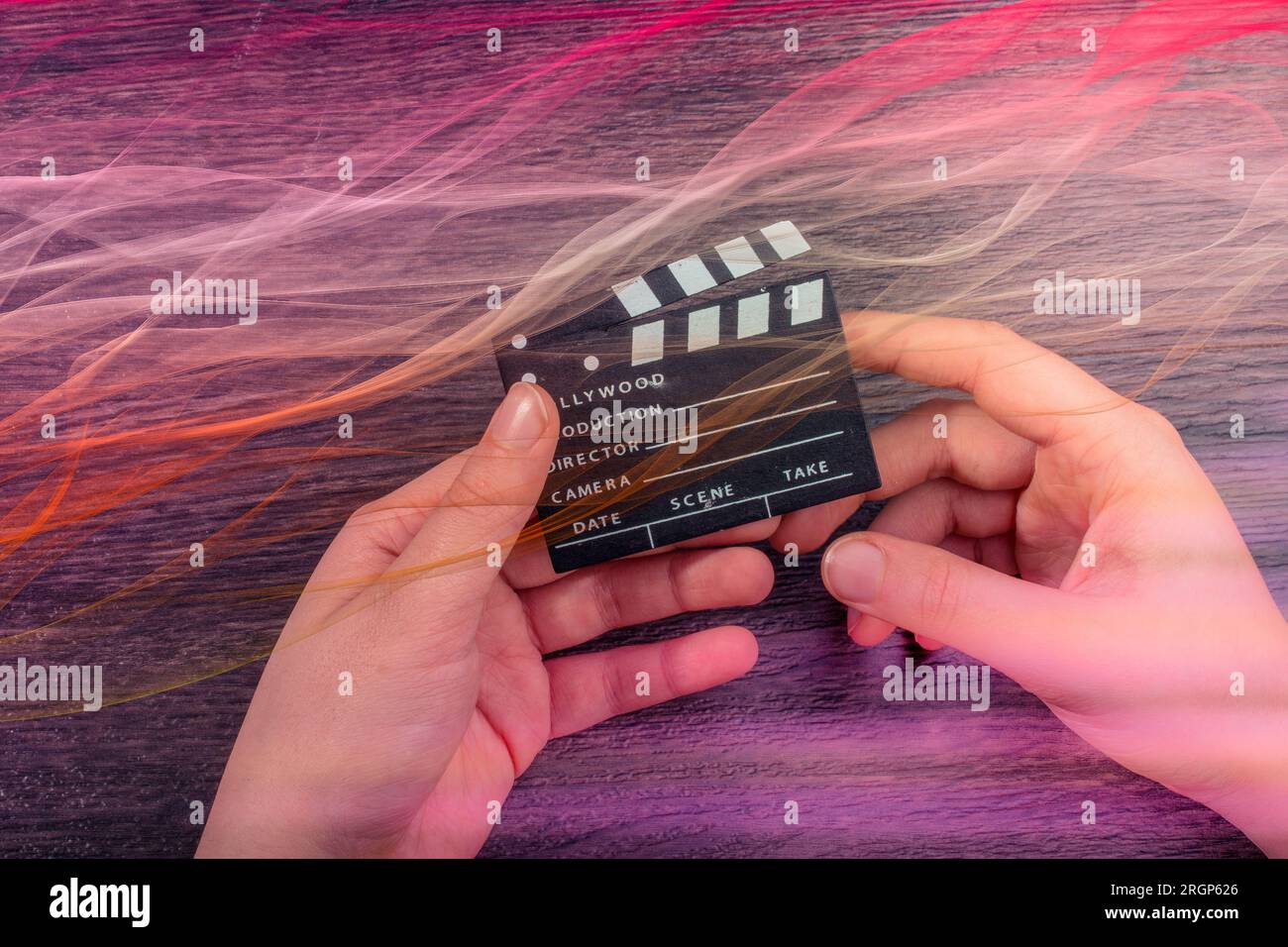 A movie production object clapper board in hand Stock Photo - Alamy